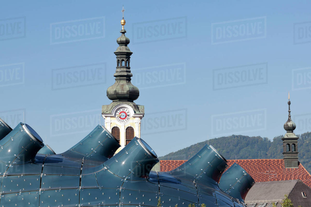 The Kunsthaus Graz in the foreground with traditional Baroque bell ...