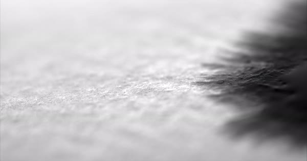 Ink reveal as black ink runs and bleeds on white paper - Stock Video ...