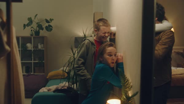 Two children eavesdrop through wall using glass - 4K Royalty-free Stock ...