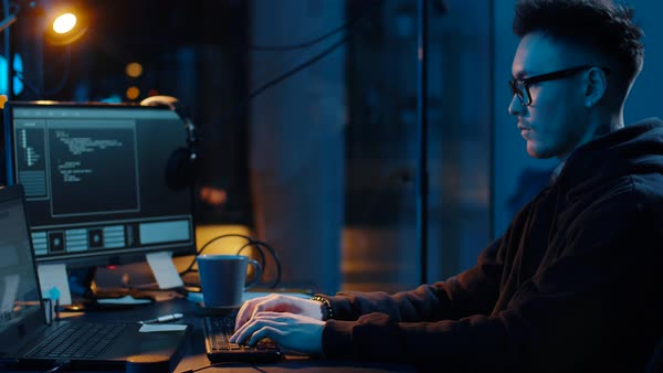 Hacker wearing glasses trying to access system after being denied at ...