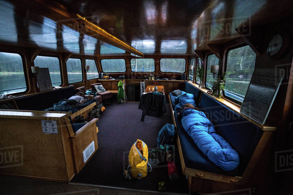 Man and woman sleeping in houseboat, Alaska, United States of America ...