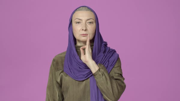 Patience, relaxation and buddhism concept. Calm middle-aged female monk ...