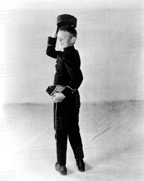 Bellboy tipping his hat - Royalty-free Stock Photo | Dissolve