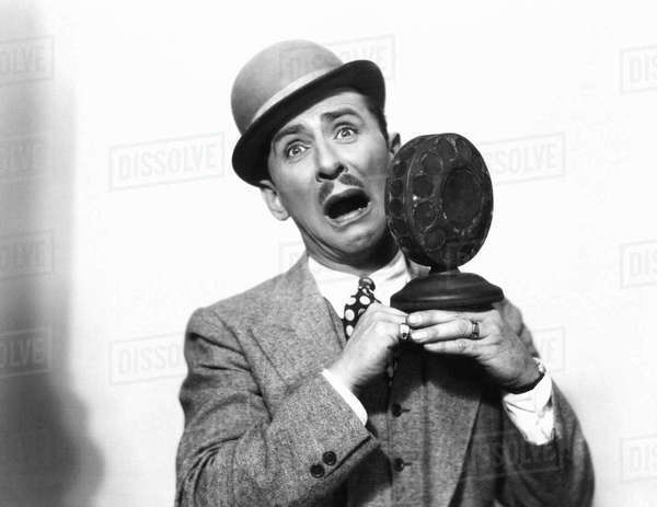 Man crying into a microphone - Royalty-free Stock Photo | Dissolve