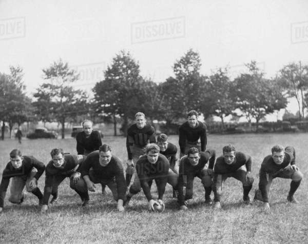 Football team in field - Stock Photo - Dissolve