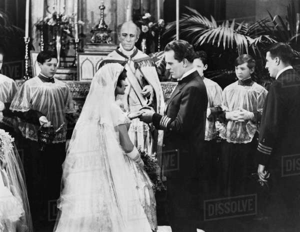 Couple getting married in church - Royalty-free Stock Photo | Dissolve