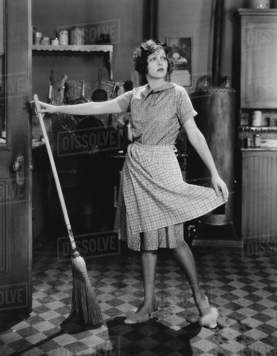 Woman with broom - Royalty-free Stock Photo | Dissolve