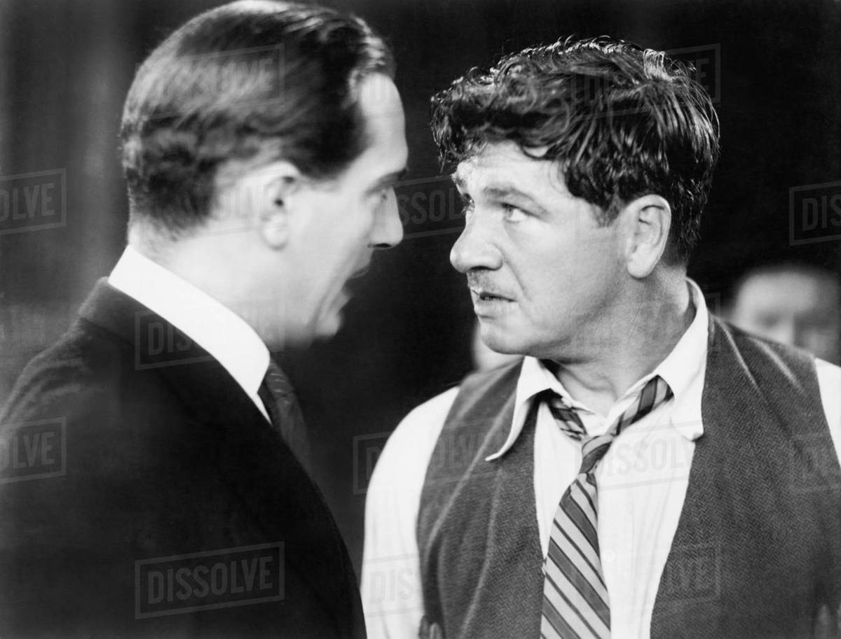 Two men looking angrily at each other - Royalty-free Stock Photo | Dissolve