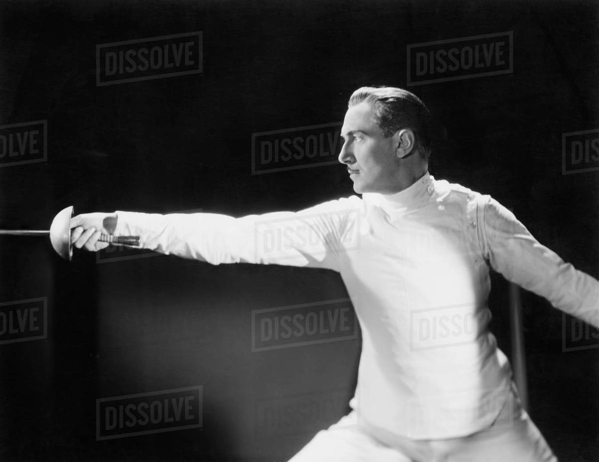 Man in a fencing position - Stock Photo - Dissolve