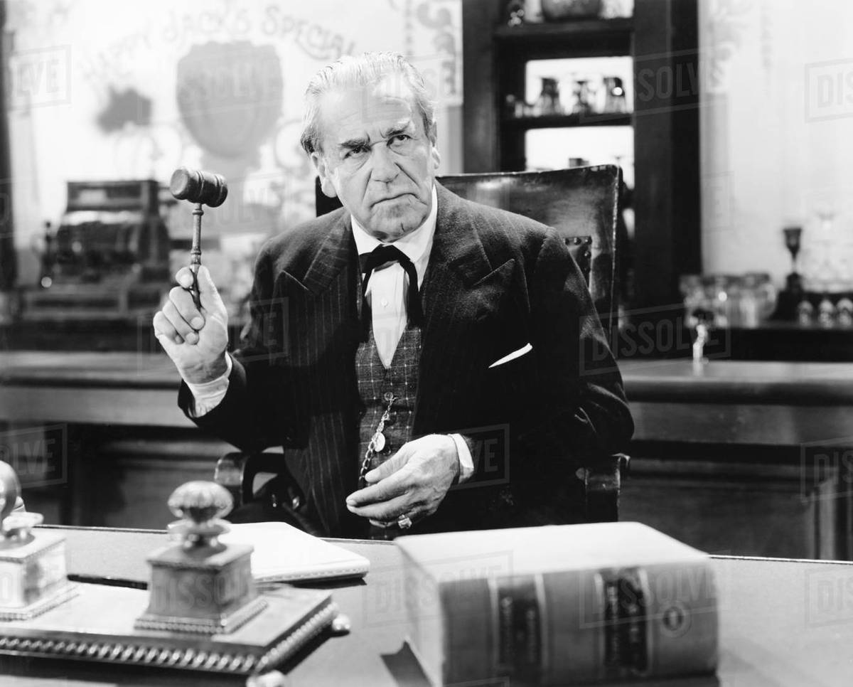 Judge with a hammer of justice - Royalty-free Stock Photo | Dissolve