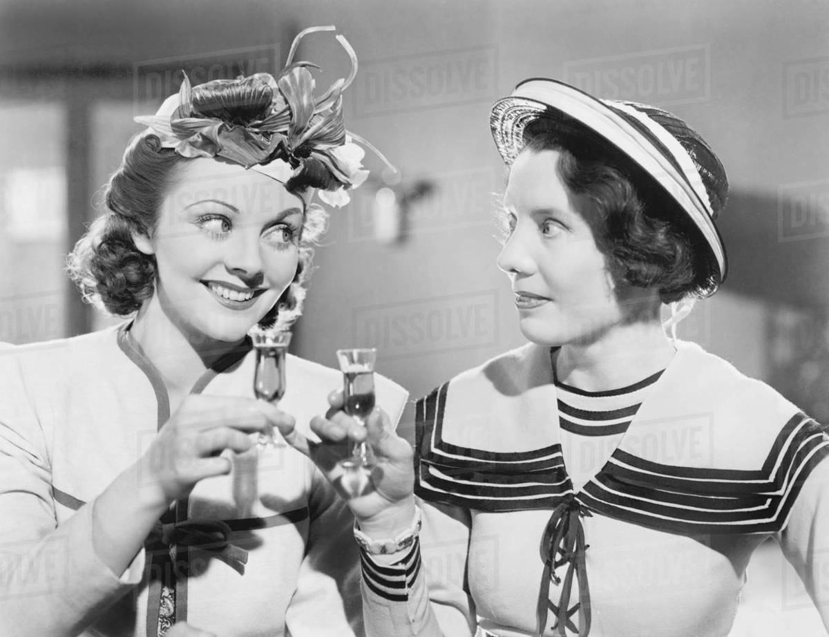 Two women drinking a schnapps - Royalty-free Stock Photo | Dissolve