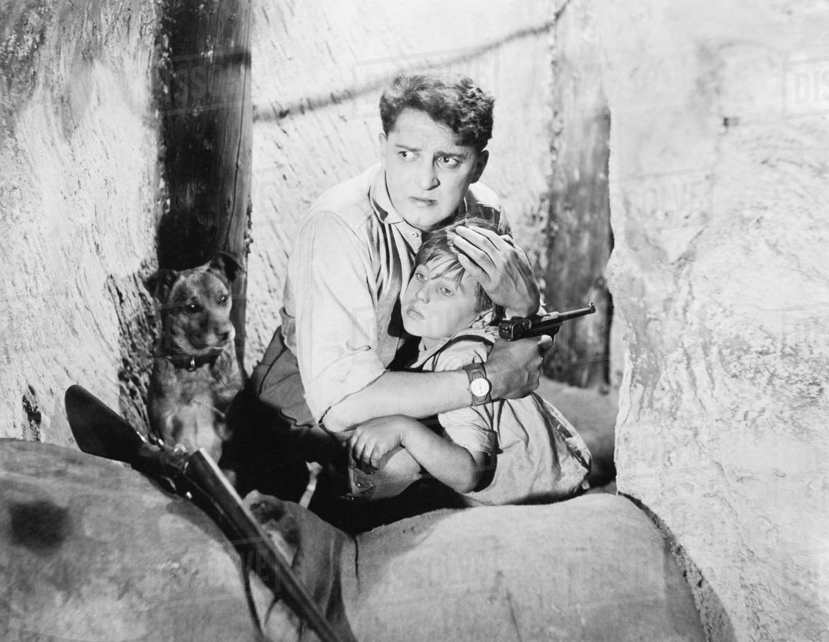 Father protecting his son with a gun in hand - Royalty-free Stock Photo ...