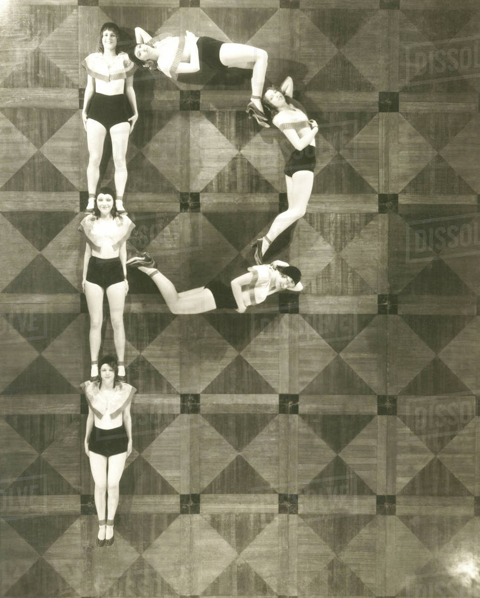 High angle view of women forming the letter "P" - Stock Photo - Dissolve