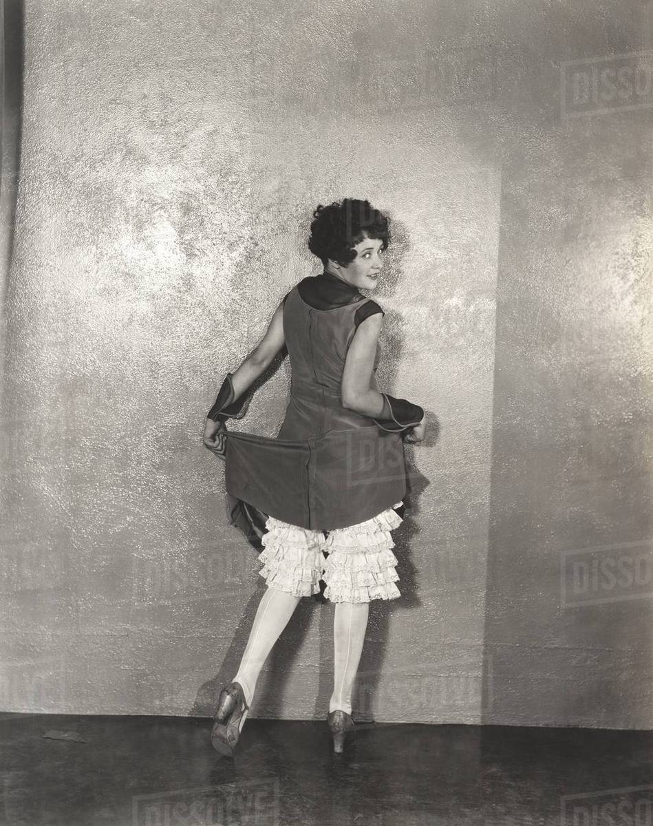 Woman lifting her dress to reveal pantalettes - Royalty-free Stock ...