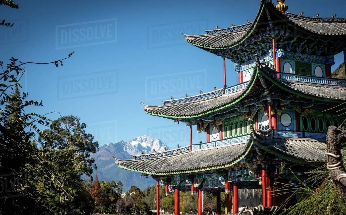 Black Dragon Lake temple with Holy Naxi mountain. Lijiang, Yunnan ...