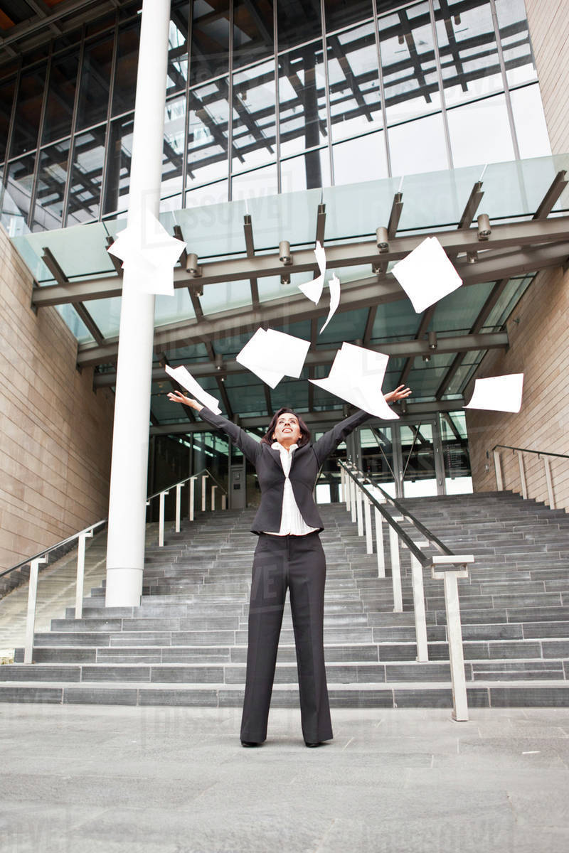 Indian businesswoman throwing papers into the air - Royalty-free Stock ...