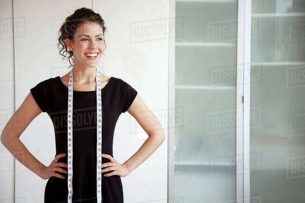 Businesswoman with measuring tape around her neck - Royalty-free Stock ...