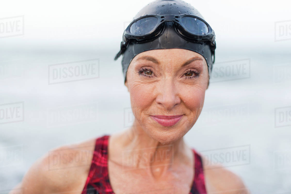Caucasian swimmer smiling - Stock Photo - Dissolve