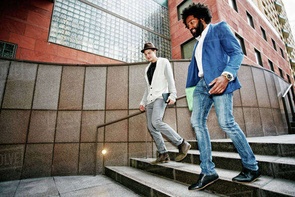 Businessmen talking on steps - Royalty-free Stock Photo | Dissolve