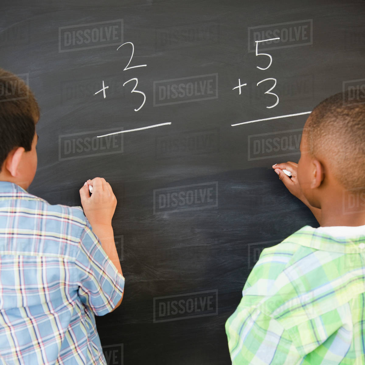 Boys solving math problems on blackboard - Royalty-free Stock Photo ...