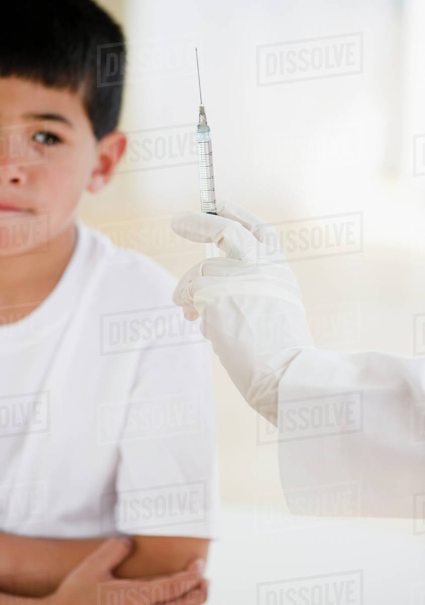Mixed race boy worrying about injection - Royalty-free Stock Photo ...