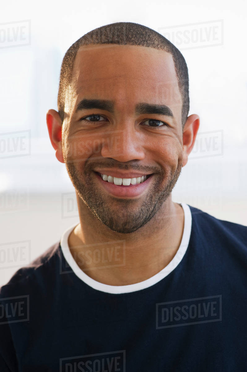 Mixed race man smiling - Stock Photo - Dissolve