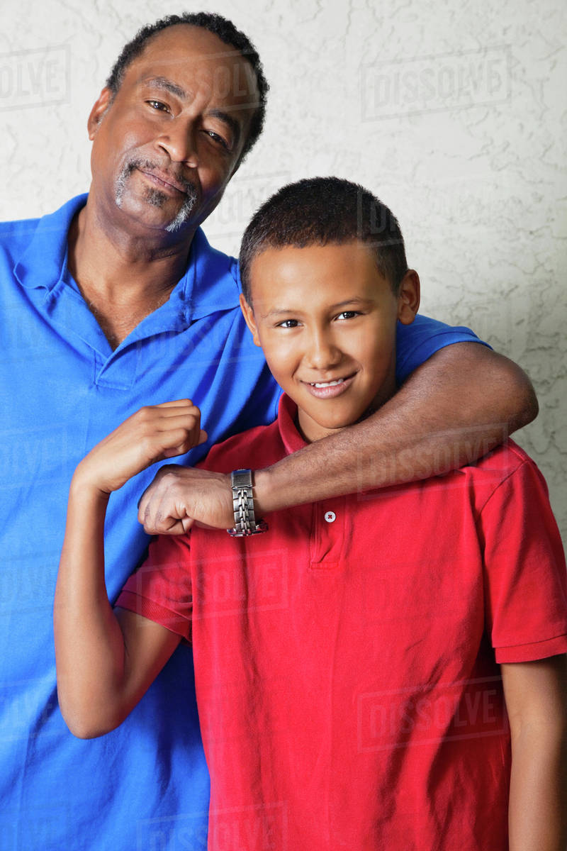 Black father hugging son - Royalty-free Stock Photo | Dissolve