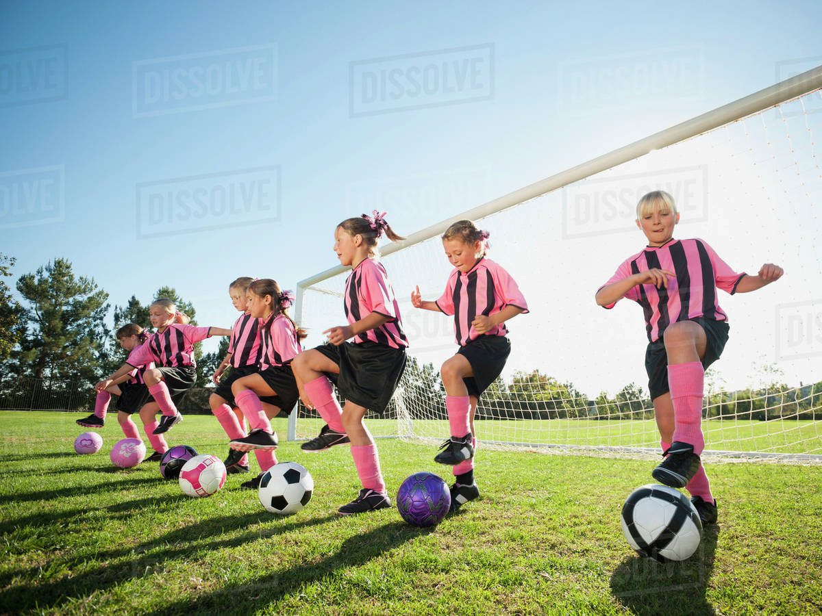Girl soccer players practicing near net - Royalty-free Stock Photo ...
