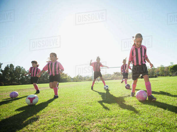 Girl soccer players practicing with soccer balls - Royalty-free Stock ...