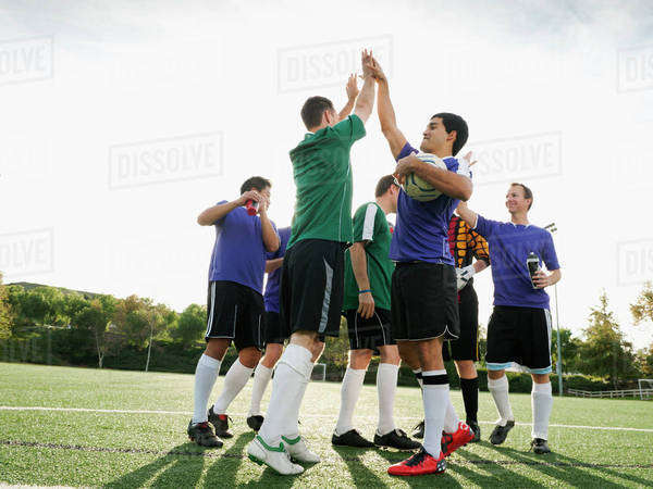 Soccer players cheering on soccer field - Royalty-free Stock Photo ...