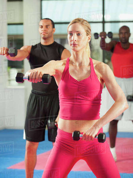 People exercising with hand weights in health club - Royalty-free Stock ...