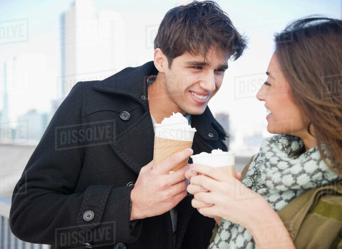 Couple drinking coffee together - Royalty-free Stock Photo | Dissolve