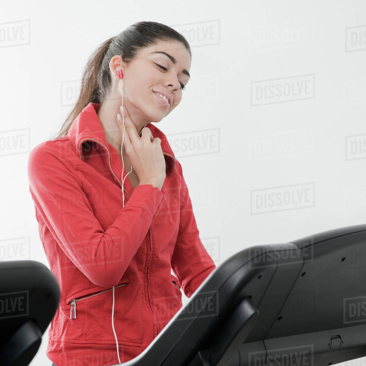 Hispanic woman checking pulse rate in health club - Royalty-free Stock ...