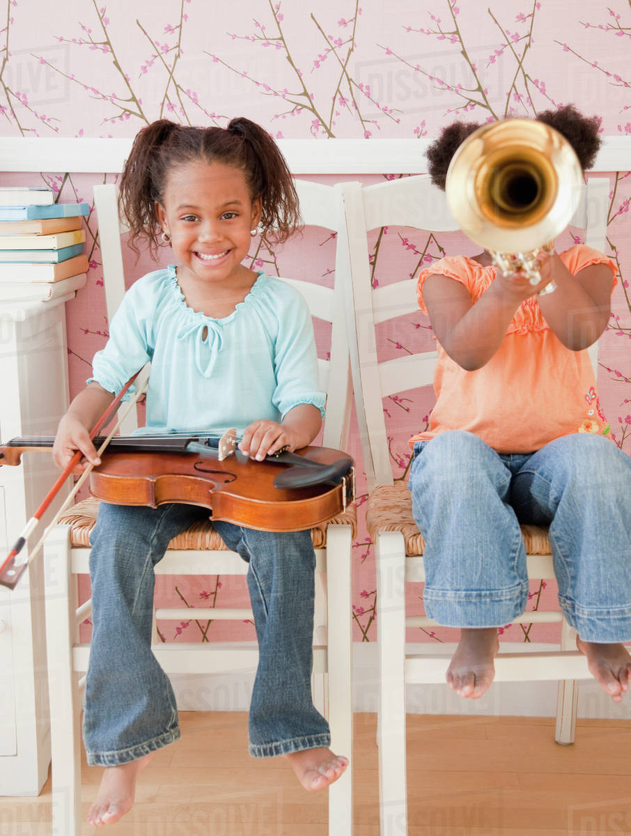 African girls playing instruments - Royalty-free Stock Photo | Dissolve