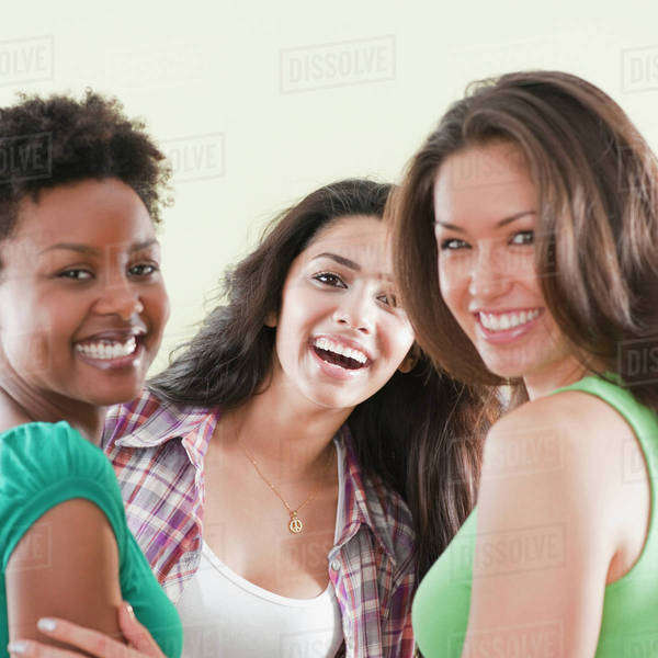 Friends smiling together - Royalty-free Stock Photo | Dissolve