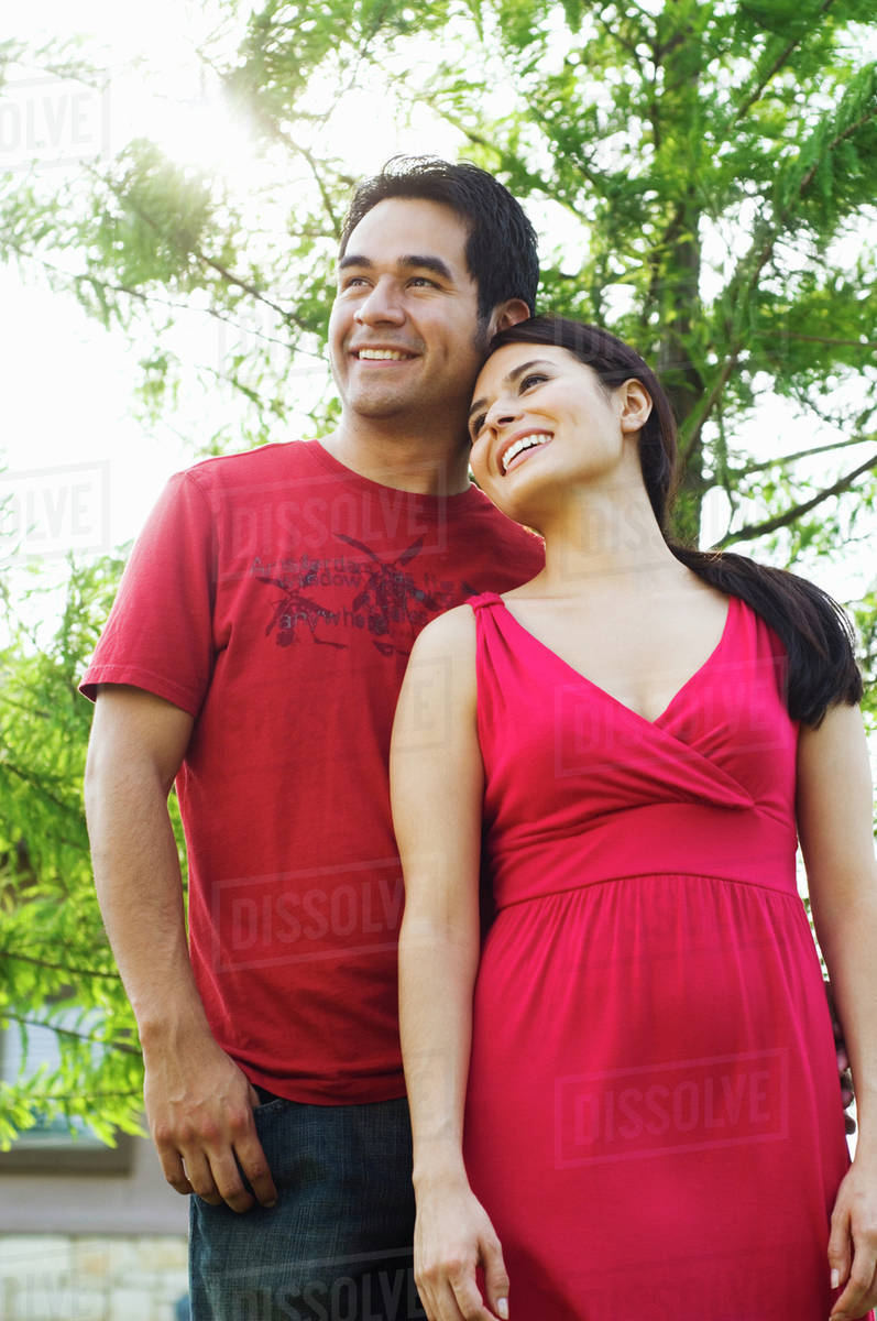 Hispanic couple standing together outdoors - Royalty-free Stock Photo ...