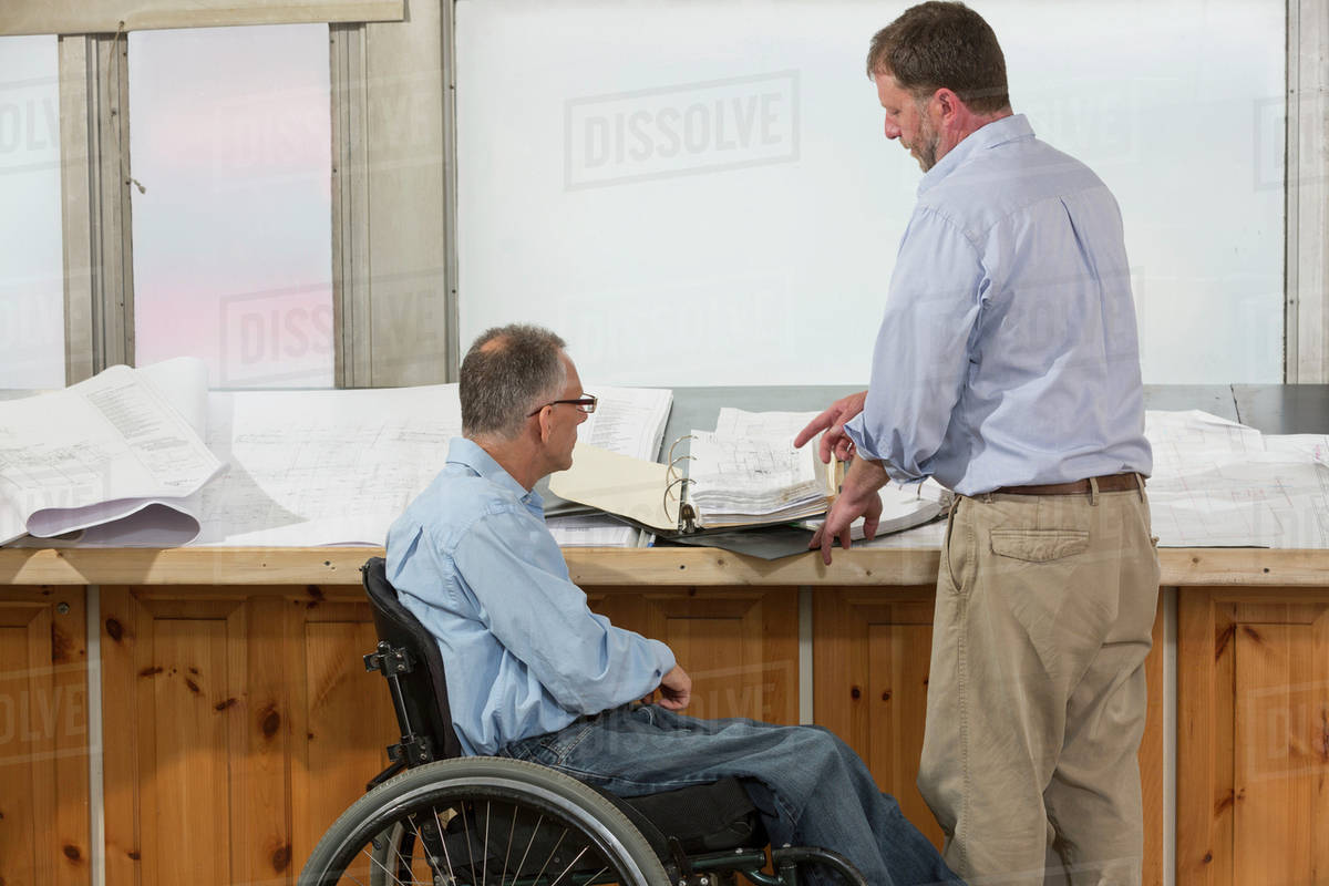 Caucasian architects talking in office - Royalty-free Stock Photo ...