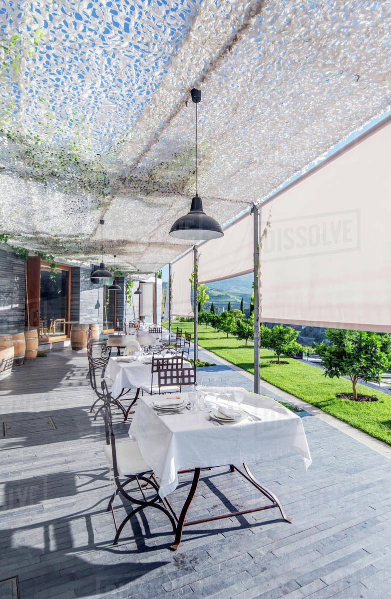 Tables at open-air cafe - Royalty-free Stock Photo | Dissolve