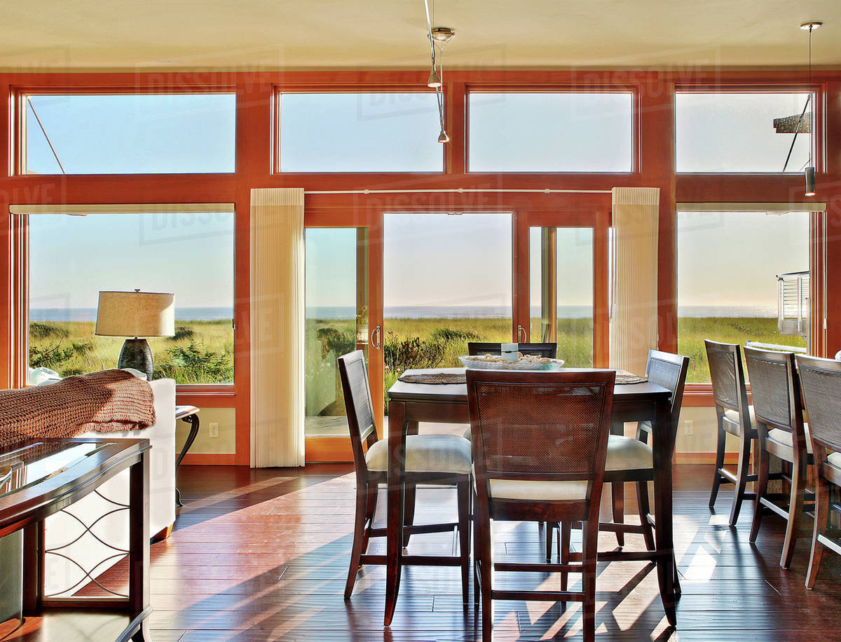 Ocean view through window in dining room - Stock Photo - Dissolve