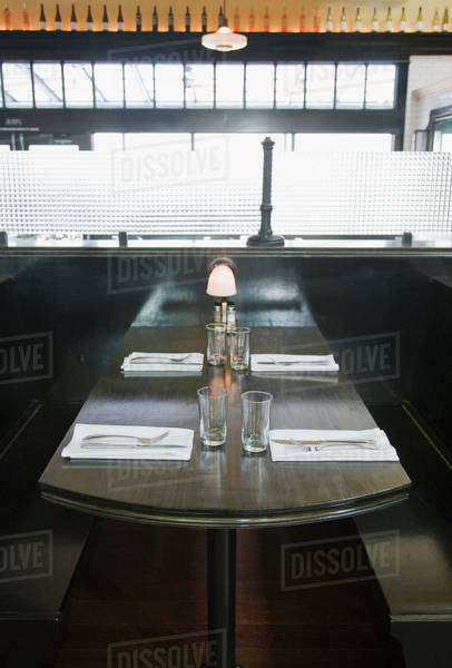 Place settings on empty booth table in restaurant - Royalty-free Stock ...