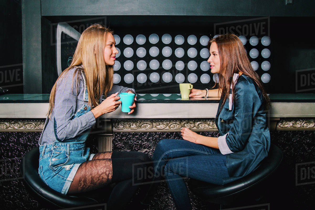 Women talking in coffee shop - Royalty-free Stock Photo | Dissolve
