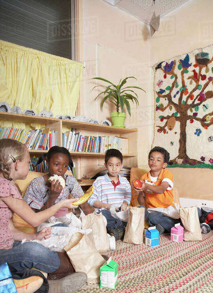 Multi-ethnic school children eating lunch - Royalty-free Stock Photo ...