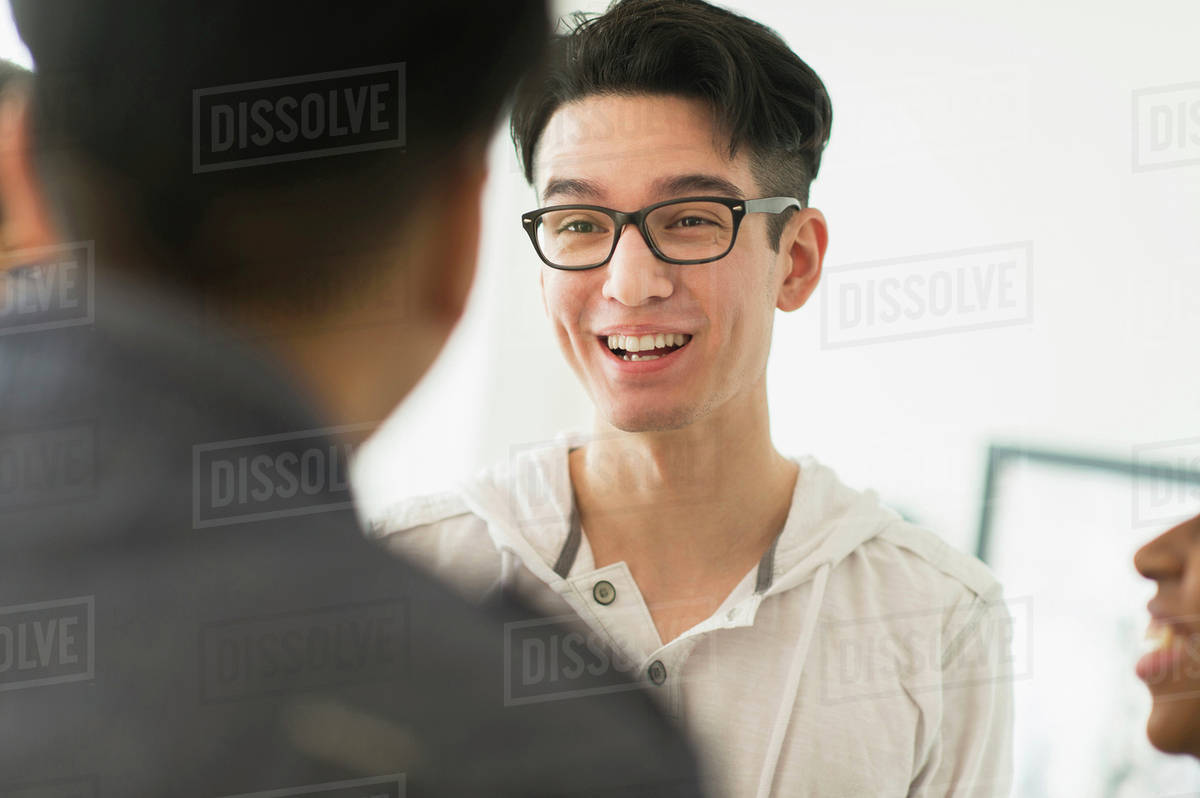 Smiling friends talking - Royalty-free Stock Photo | Dissolve