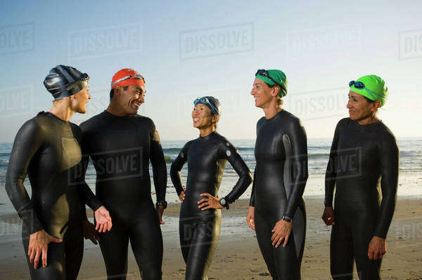 Multi-ethnic swimmers wearing wetsuits and goggles - Royalty-free Stock ...