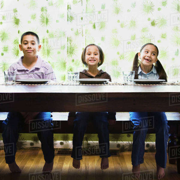 Asian siblings sitting at dinner table - Royalty-free Stock Photo ...