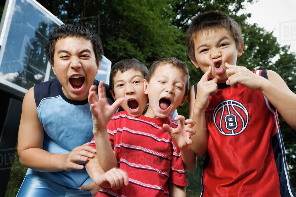 Asian brothers yelling on basketball court - Royalty-free Stock Photo ...
