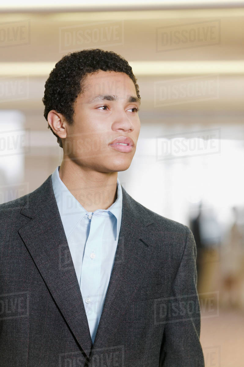 Mixed race businessman looking pensive - Royalty-free Stock Photo ...