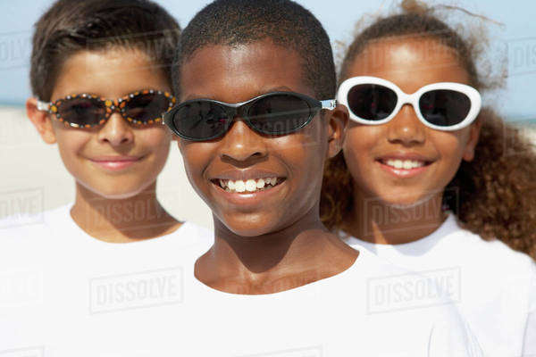 Smiling children wearing sunglasses - Royalty-free Stock Photo | Dissolve