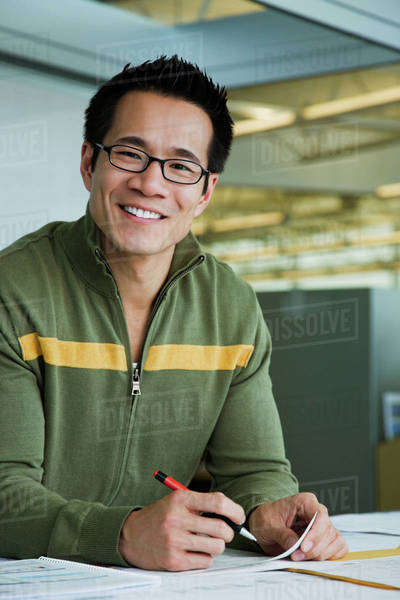 Asian American businessman working in office - Royalty-free Stock Photo ...
