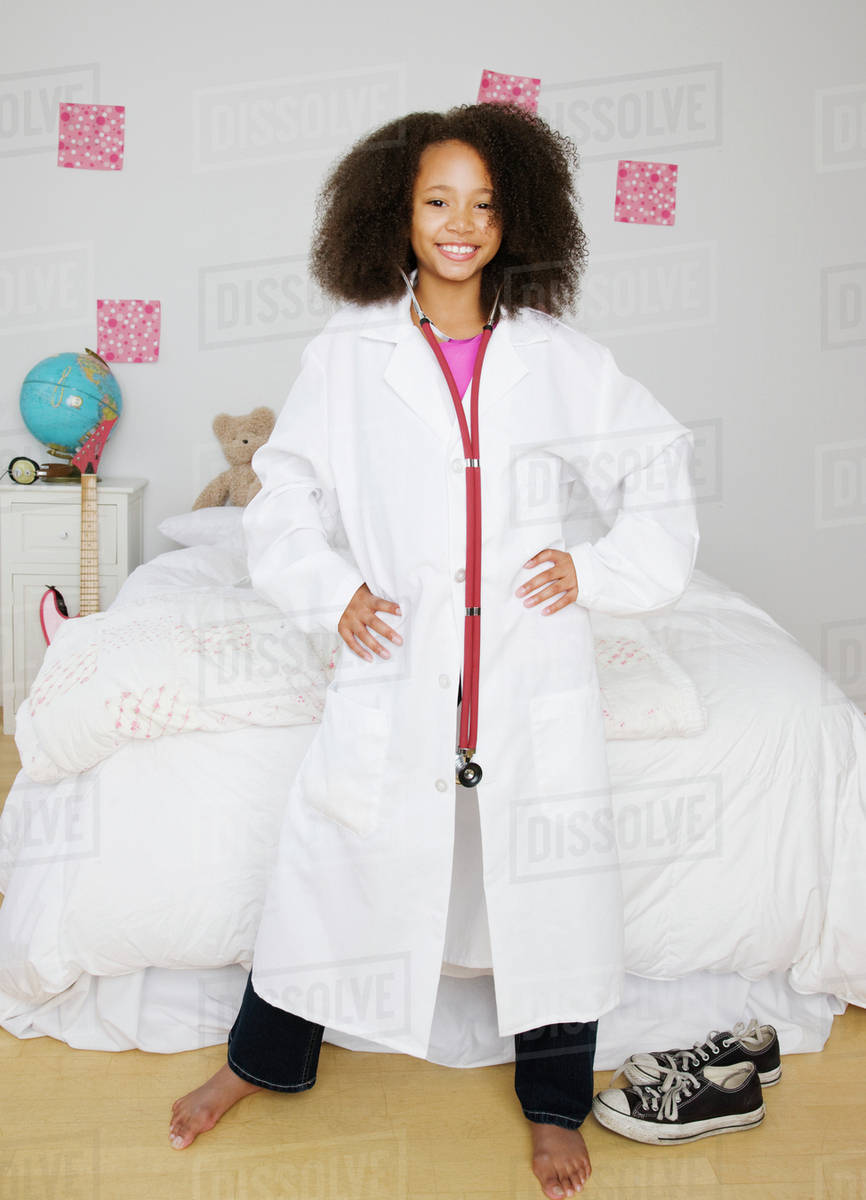 African girl dressed as doctor in bedroom - Royalty-free Stock Photo ...